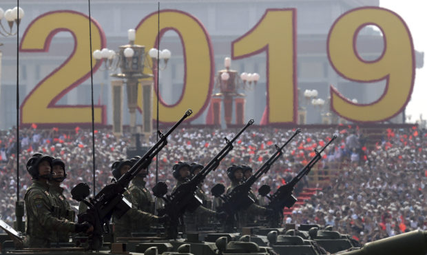 China's 70-year parade shows global ambition as HK protests